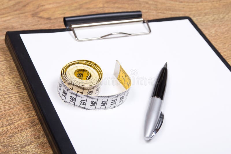 Clipboard, Pen and Measure Tape on the Table Stock Photo - Image of ...