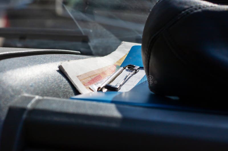 A Clipboard is Placed on the Dashboard of a Car Providing Notes Stock ...