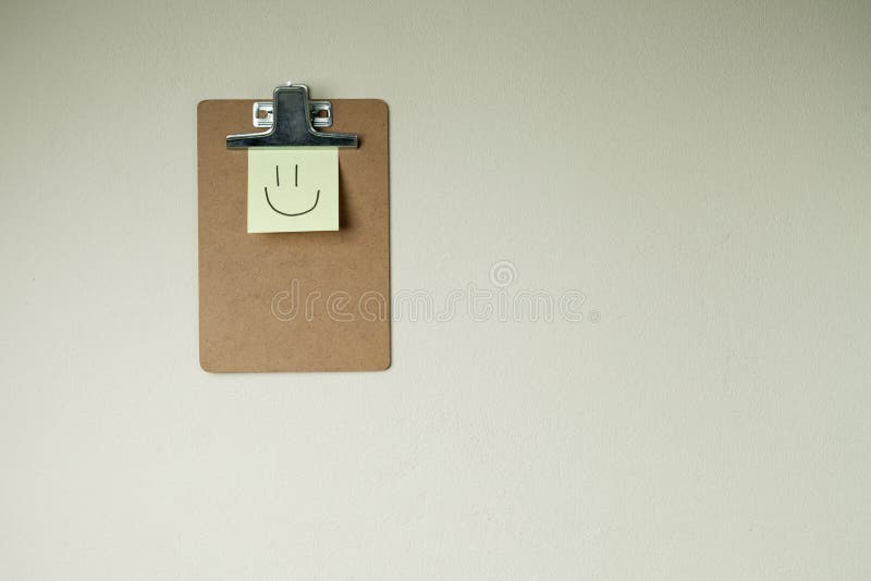 Clipboard with Post it Notes and Smile on the Wall. Stock Photo - Image ...