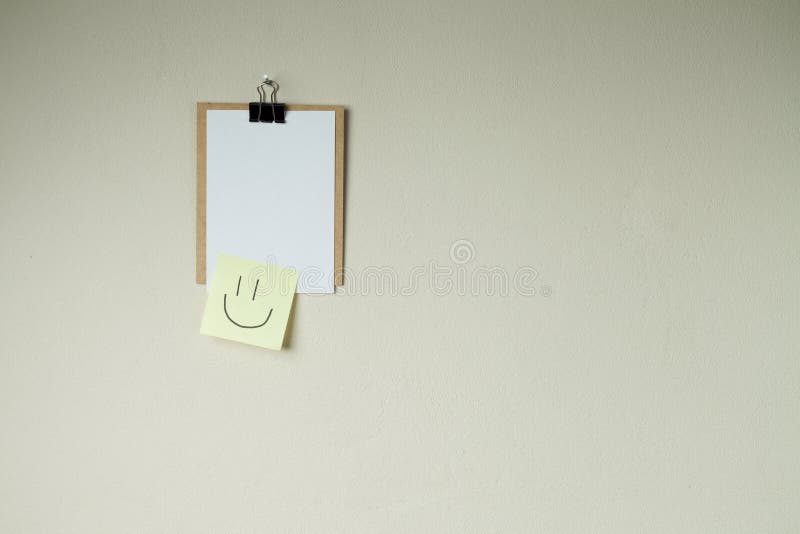 Clipboard with Post it Notes and Smile on the Wall. Stock Image - Image ...
