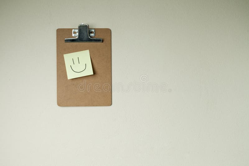 Clipboard with Post it Notes and Smile on the Wall. Stock Image - Image ...