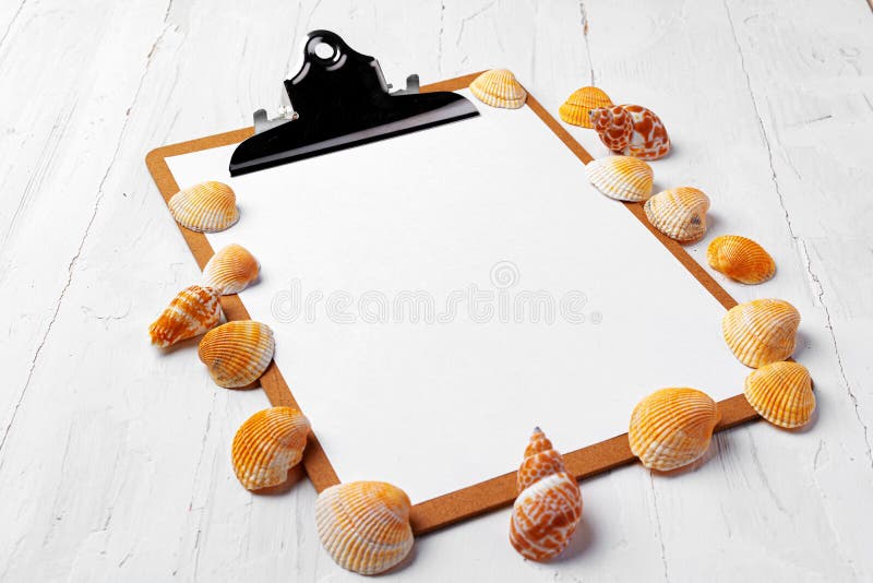 Clipboard with Sea Shells on Wooden Table Close Up, Copy Space Stock ...