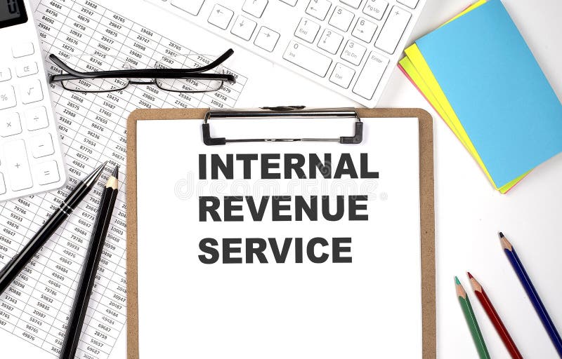 Clipboard with Text INTERNAL REVENUE SERVICE Keyboard and Chart on ...