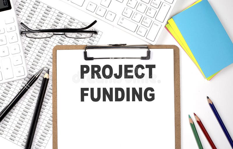 Clipboard with Text PROJECT FUNDING and Keyboard and Chart on the White ...