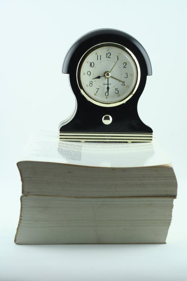 Clock above book stock image. Image of isolated, study - 7481387