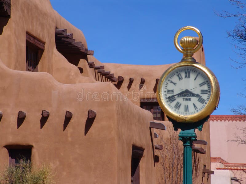 Clock with Adobe Building in Santa Fe Stock Photo - Image of building ...