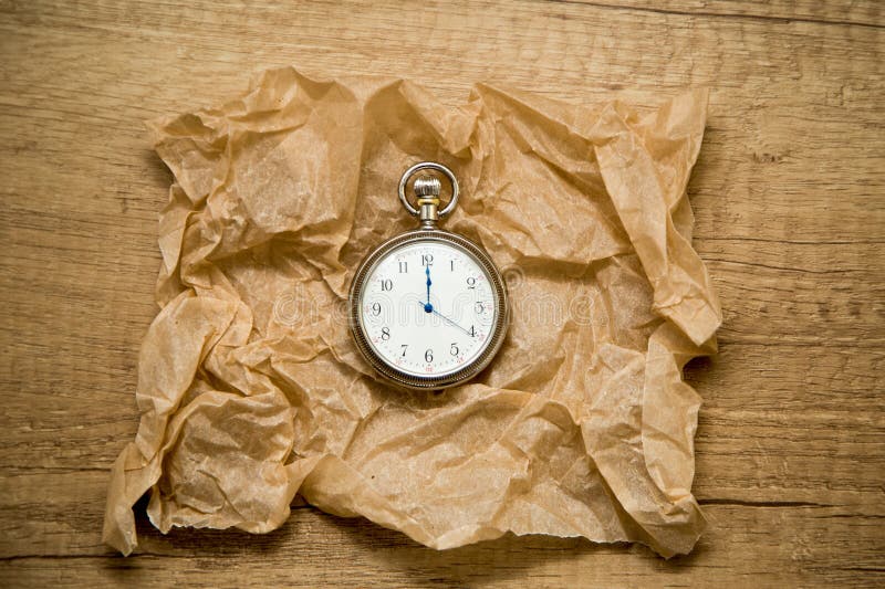 Clock with Arrows at Midnight on a Craft Paper Background Stock Photo ...