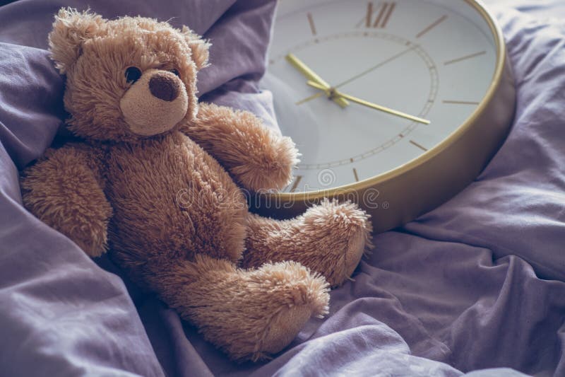 Clock in bed on a blanket stock image. Image of love - 187169677