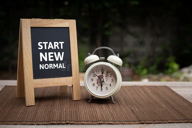 A Clock and Blackboard with Text Start New Normal Stock Image - Image ...