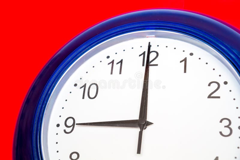 Clock with a Blue Frame on a Red Background, Nine Hours on the Dial ...