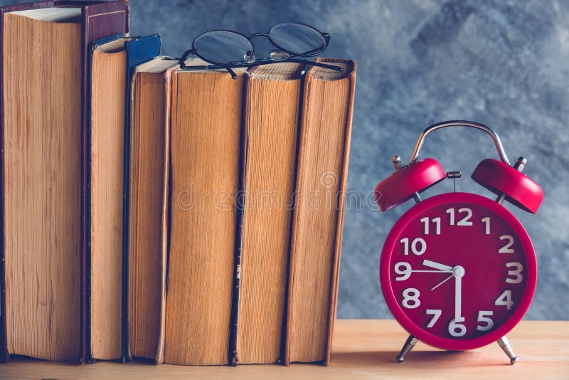 Clock and book stock image. Image of research, novel - 83422905