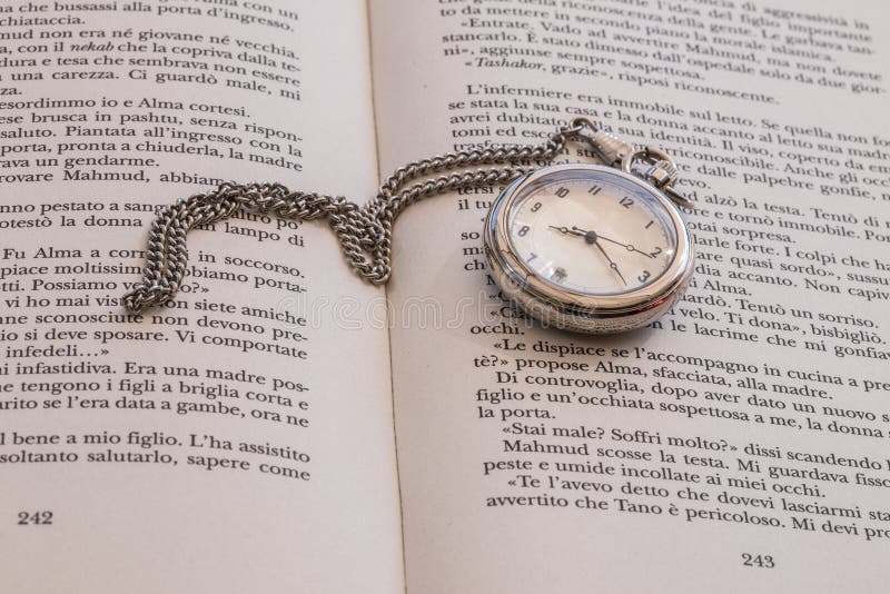 Clock on a book stock image. Image of time, pages, ring - 58339213