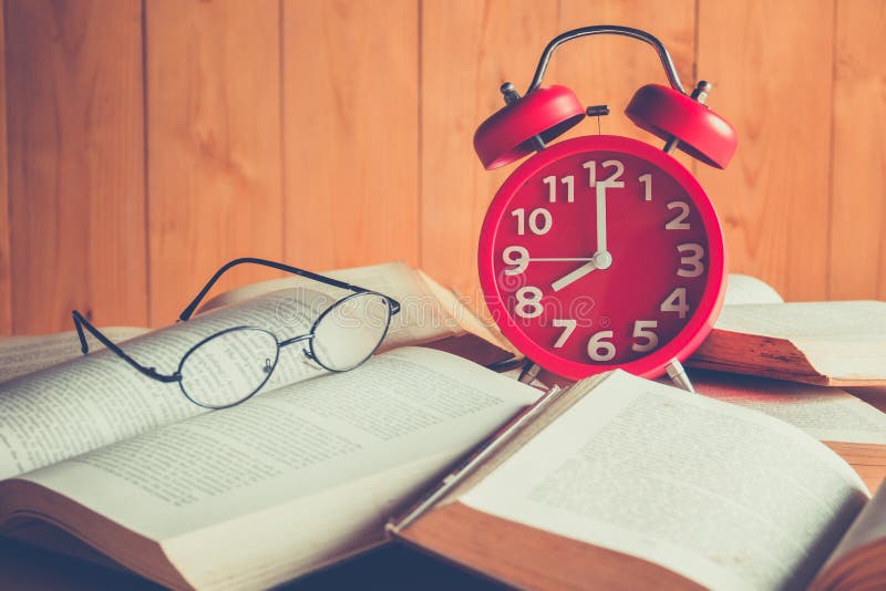 Clock and book stock image. Image of education, arts - 88686181