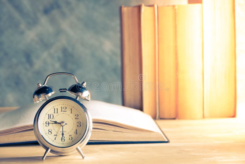 Clock and book stock photo. Image of antique, deadline - 83093666