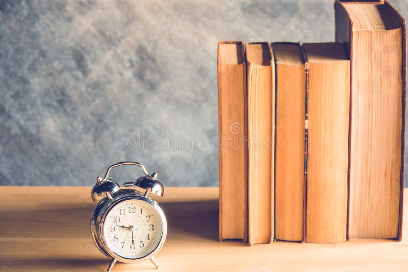 Clock and book stock photo. Image of awake, silver, hour - 83555742