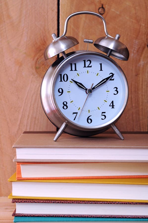 Clock with books stock image. Image of bell, paper, clock - 30782533