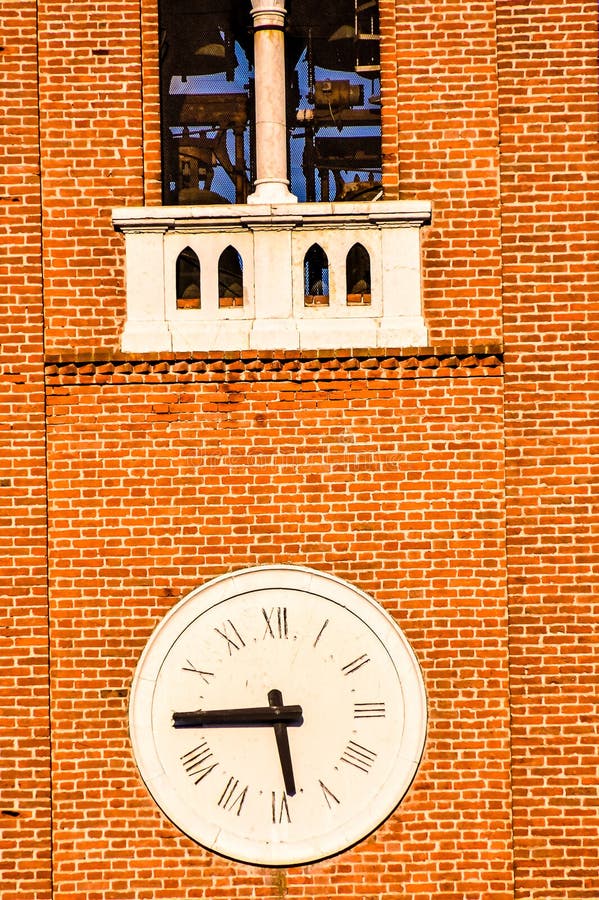 A Clock on a Brick Wall with the Hands at the Numbers 3 and 9 Stock ...