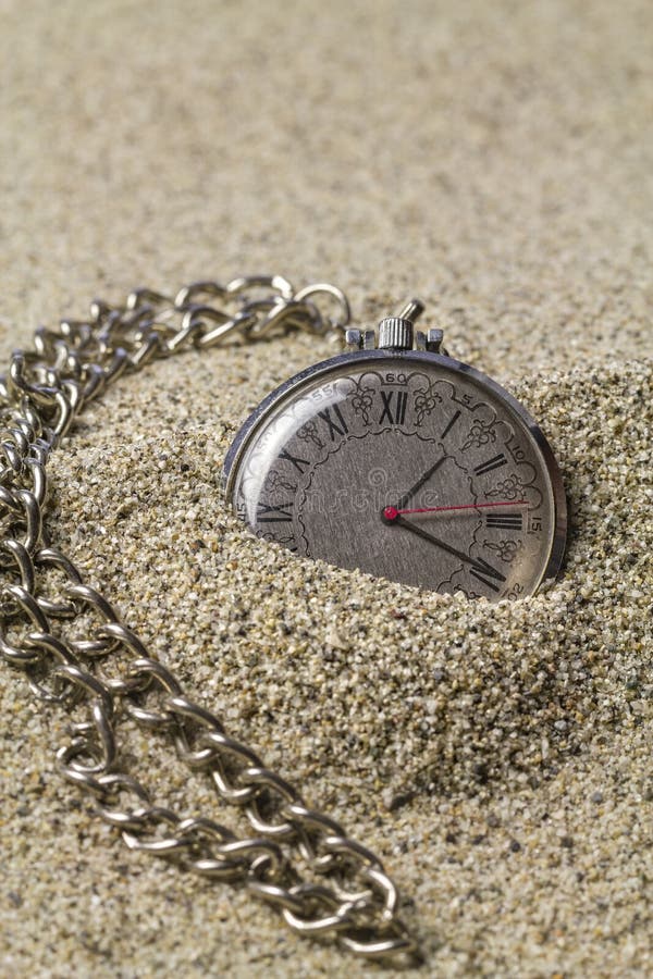 Clock with chain on sand. stock image. Image of retro - 66398969