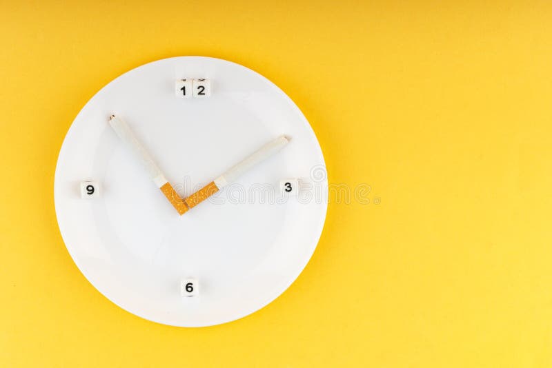 Clock from a Cigarette and a Plate with Numbers in a Circle Stock Photo ...