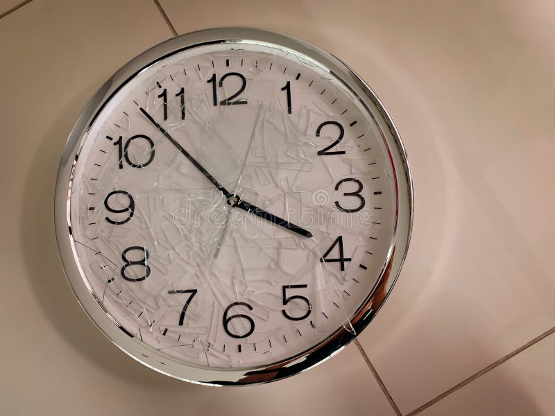A Clock with Cracked and Shattered Glass Lay on the Floor Stock Photo ...