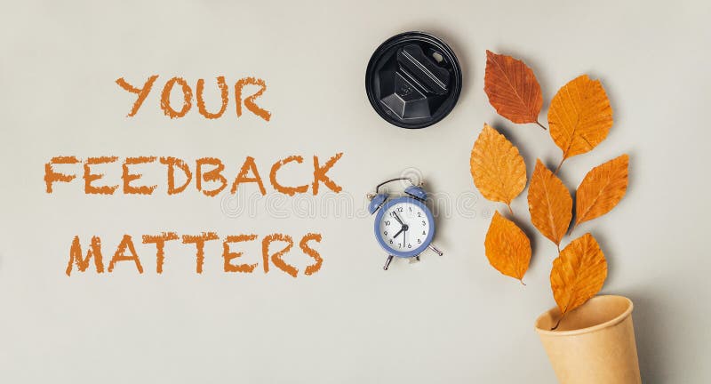 A Clock and a Cup are on a Table with the Words Your Feedback Matters ...