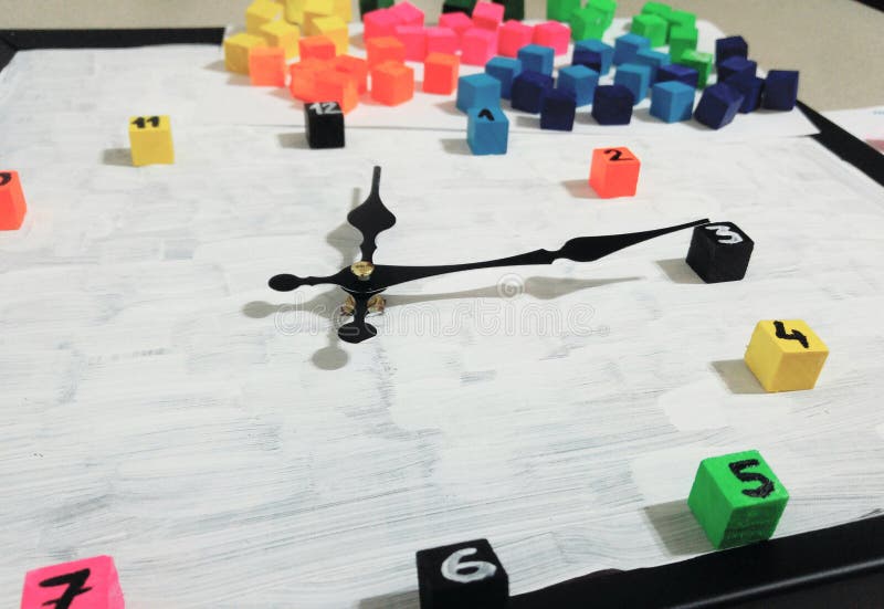 Clock with Clocks Decorated with Hand-colored Cubes Stock Image - Image ...