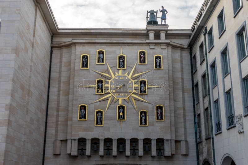A Clock with a Decoration of Knights and a Bell on Top in a Clock with ...