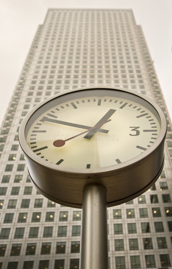 Clock Detail in Front of Skyscraper Stock Image - Image of building ...