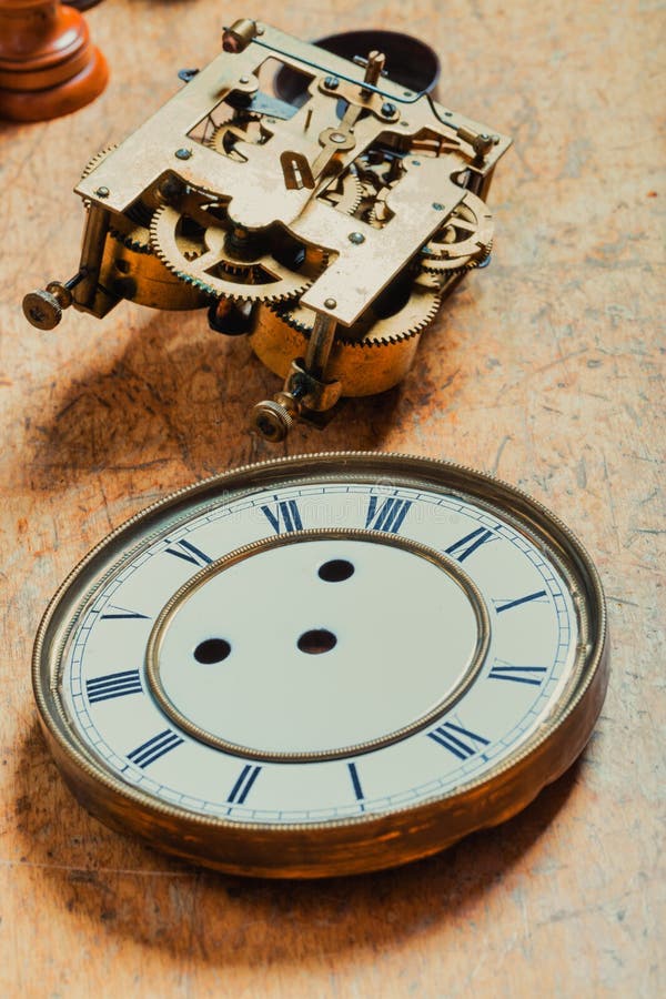 Clock Dial and Mechanism on a Clockmakers Workbench Stock Image - Image ...