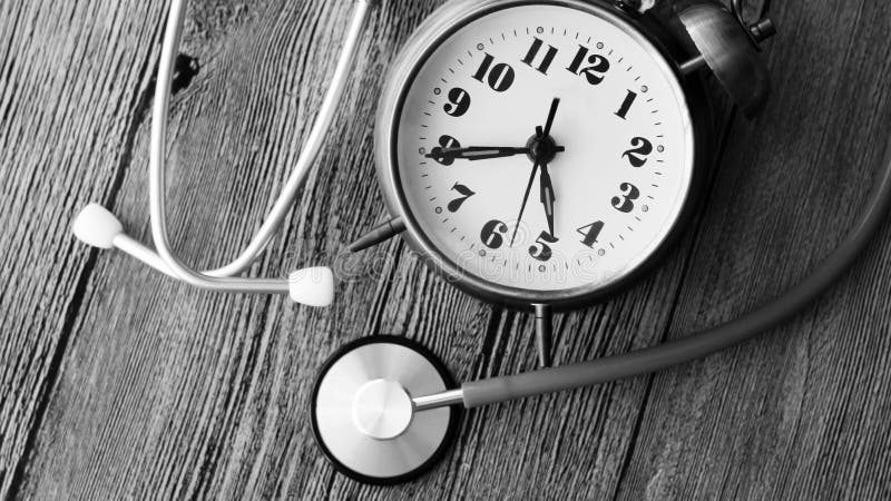 Clock on Doctor Clinic Table for Times To Healthcare Stock Photo ...