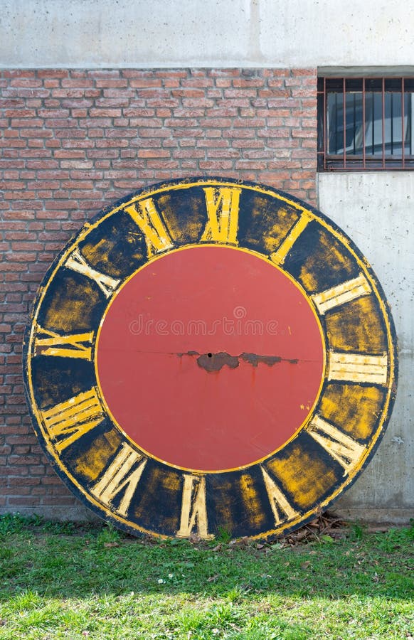 Clock Face of a Big Clock, Leaning on a Wall Stock Photo - Image of ...
