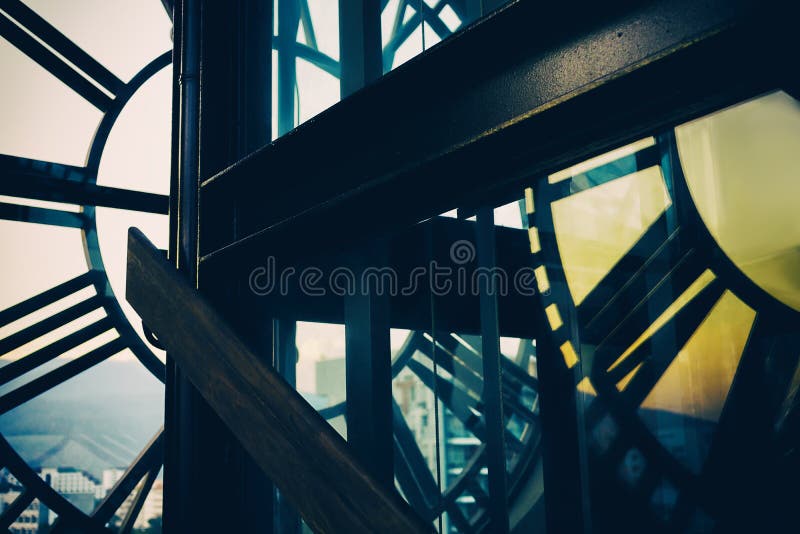 Clock Face Reflection in Glass Above City. Blue and Yellow. Sunset ...