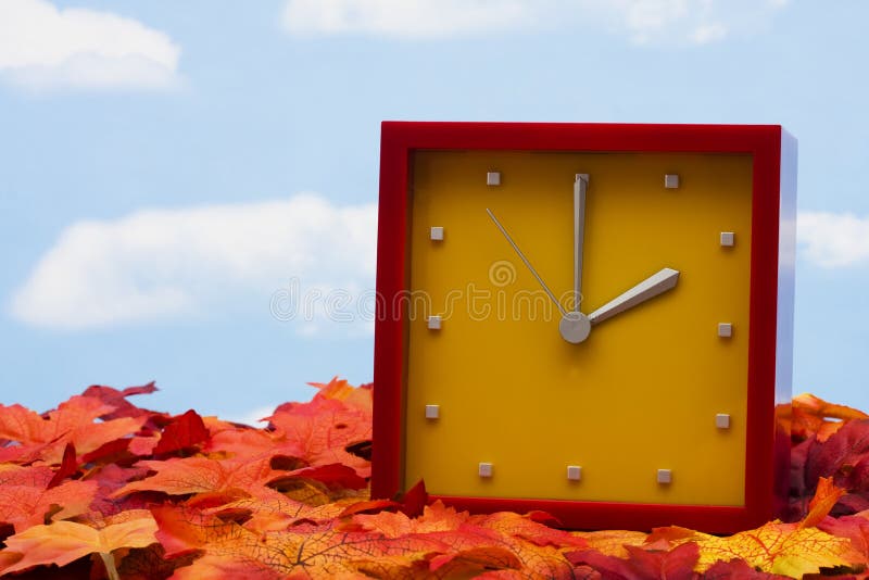 Clock on Fall Leaves stock image. Image of change, time - 5979189