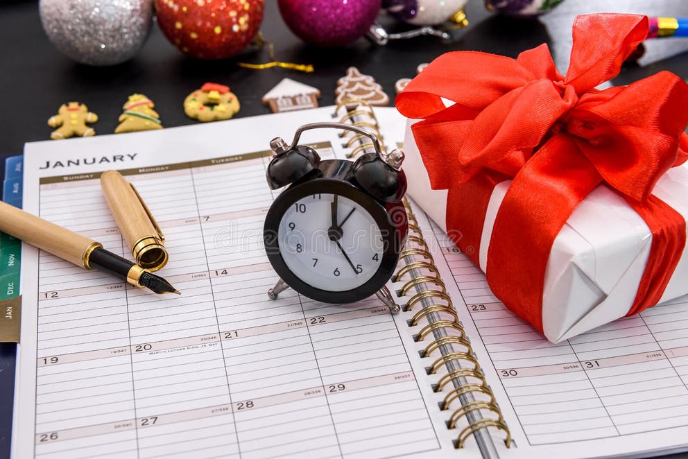 Clock with Gift Box and Notepad on Table Stock Image - Image of ...