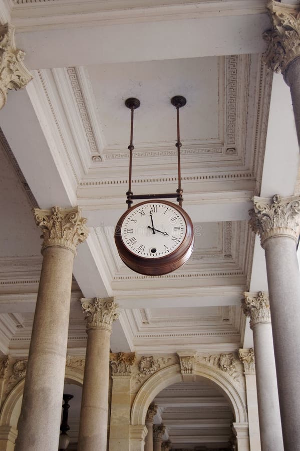 Clock Hanging on the Pillar Stock Photo - Image of public, hanging ...
