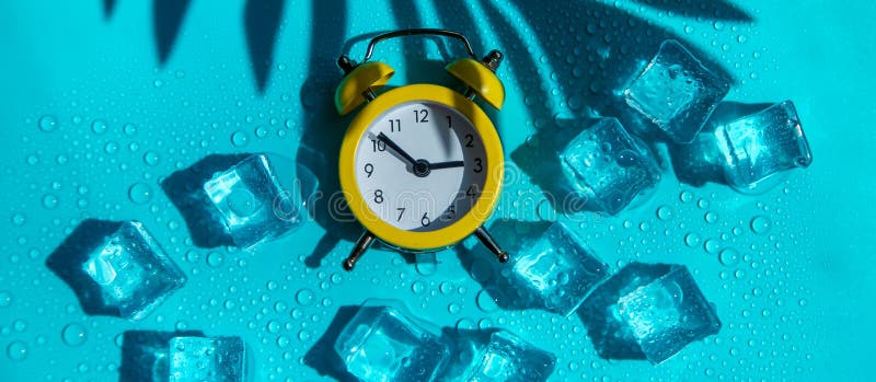 Clock and Ice Cubes. Vacation and Daylight Saving Time Concept ...