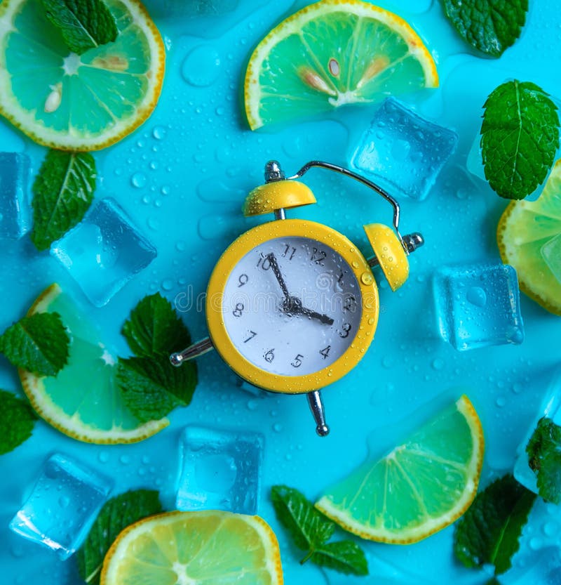 Clock and Ice Cubes. Vacation and Daylight Saving Time Concept ...