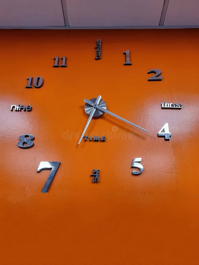 Clock Installed on an Orange Wall Editorial Image - Image of timer ...