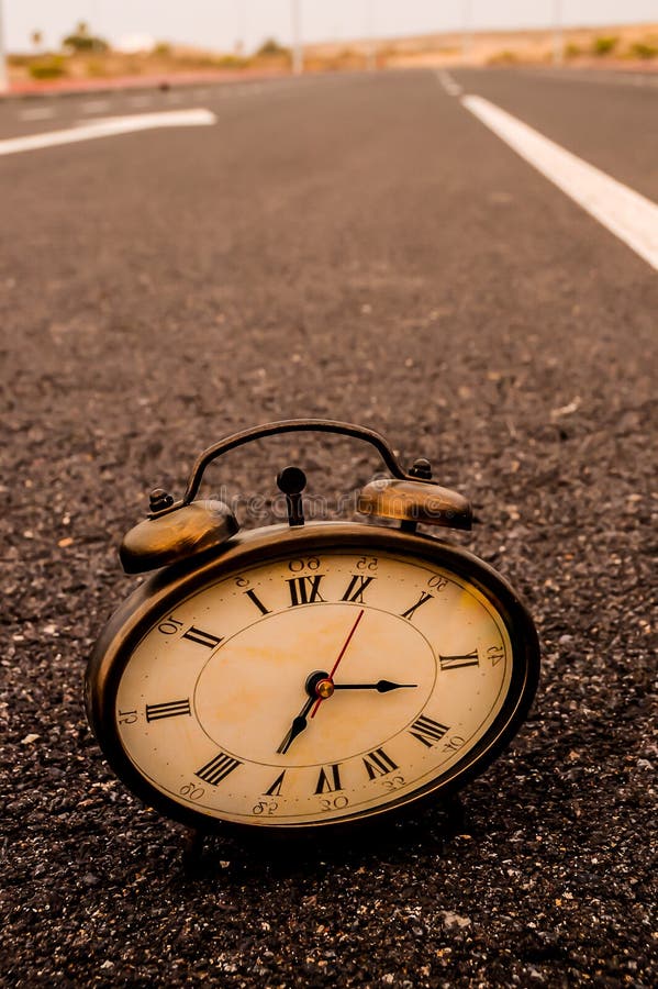 A Clock Laying on the Ground with the Hands on the Number 12 and 3 ...