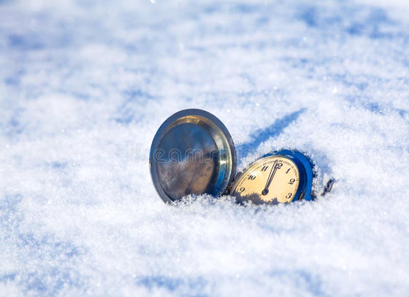 Clock lying in the snow stock photo. Image of shine, frost - 36906890