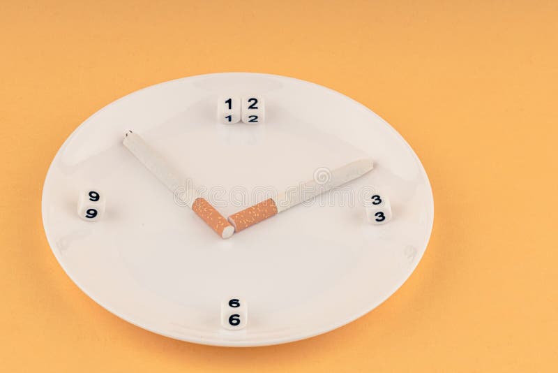A Clock Made of Cigarettes and a Dial, a Plate and Cigarettes on it ...