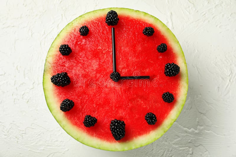 Clock Made of Delicious Watermelon on Light Background Stock Photo ...
