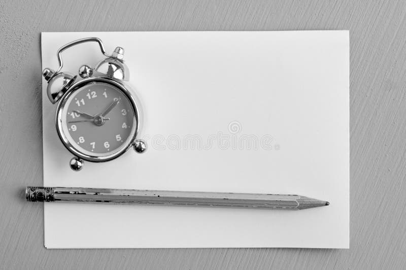 Clock and paper stock photo. Image of date, monochrome - 37351356