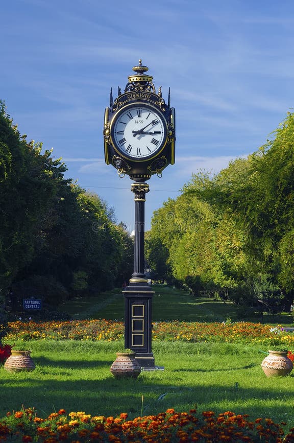 Clock in park stock image. Image of time, metal, grass - 38403469