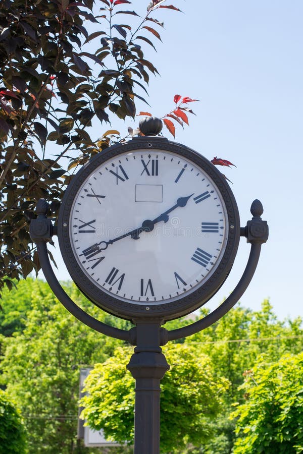 Clock in the park stock photo. Image of full, station - 60885340