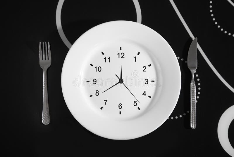 Clock on Plate with a Fork and Knife. Time To Eat Stock Photo - Image ...
