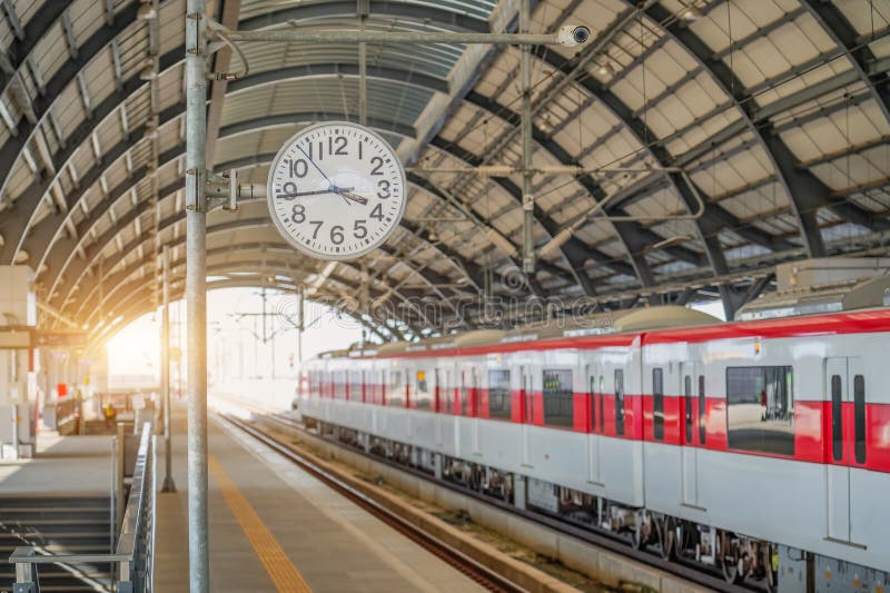 Clock on a Pole on the Passenger Platform at a Train Station Awaiting ...