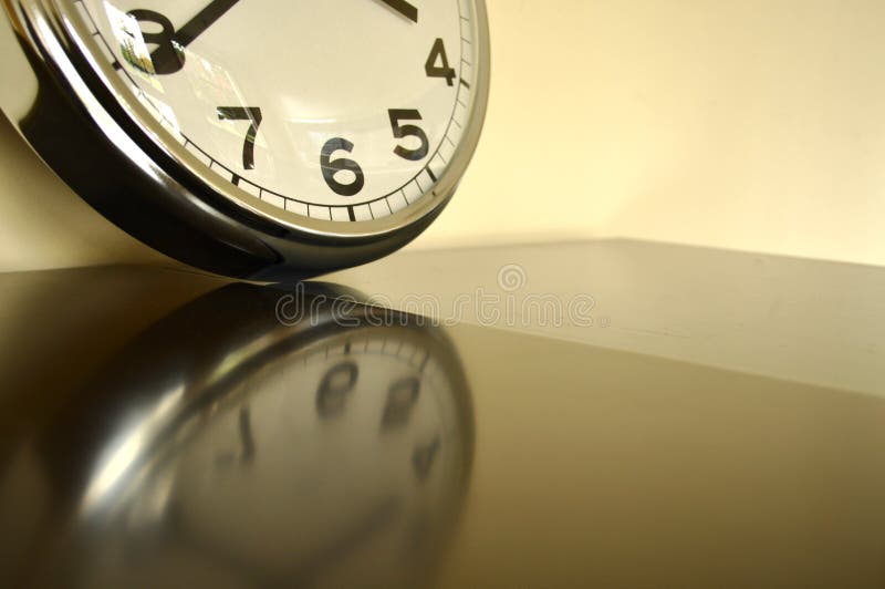 Clock on Reflective Surface Stock Photo - Image of white, time: 30754792