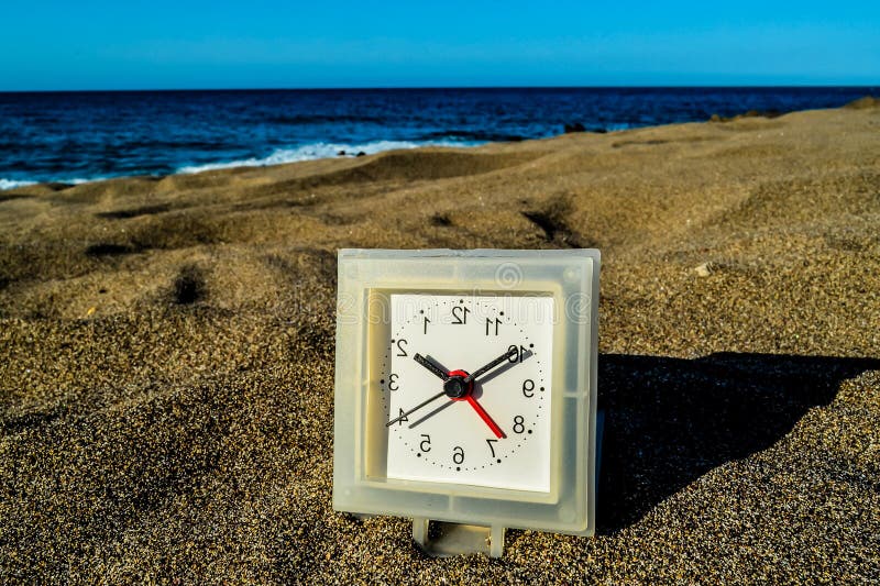 Clock on the Sand Beach stock image. Image of clock - 326680477