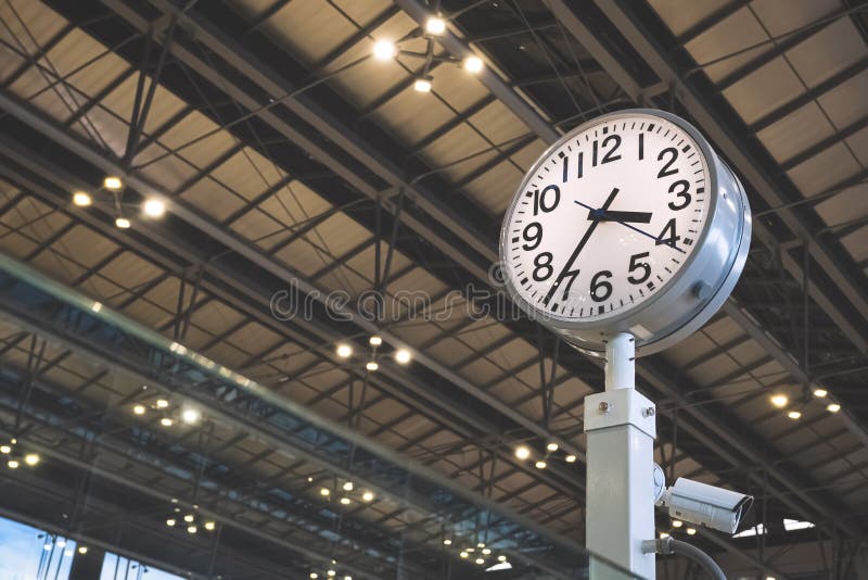 Clock with Security CCTV Surveillance Camera in the Airport Stock Photo ...